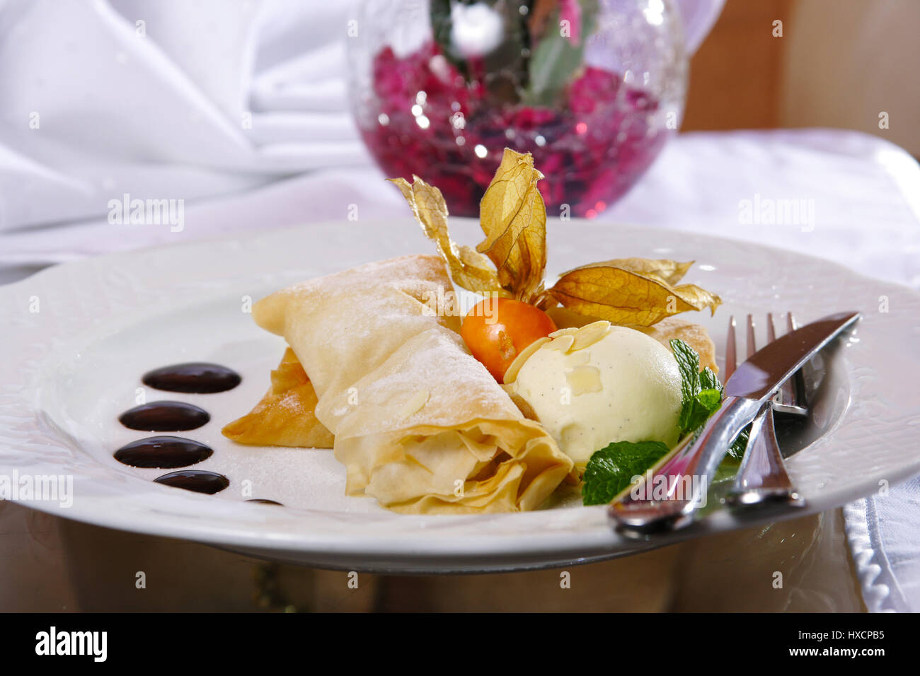 ice-cream, dessert and ground-cherry on a white plate Stock Photo - Alamy