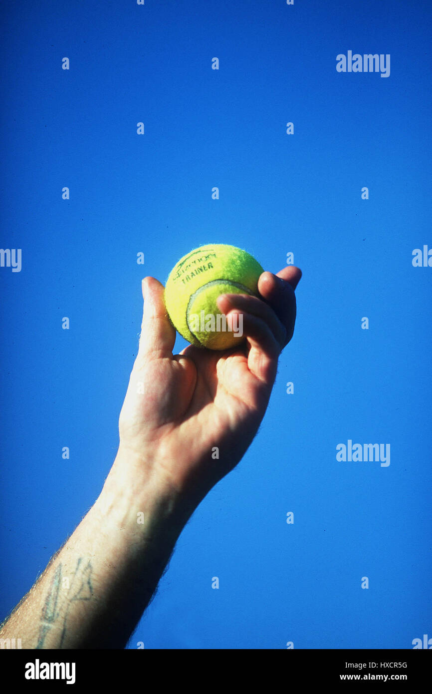 MAN HOLDS BALL TENNIS MATCH 24 August 1998 Stock Photo - Alamy