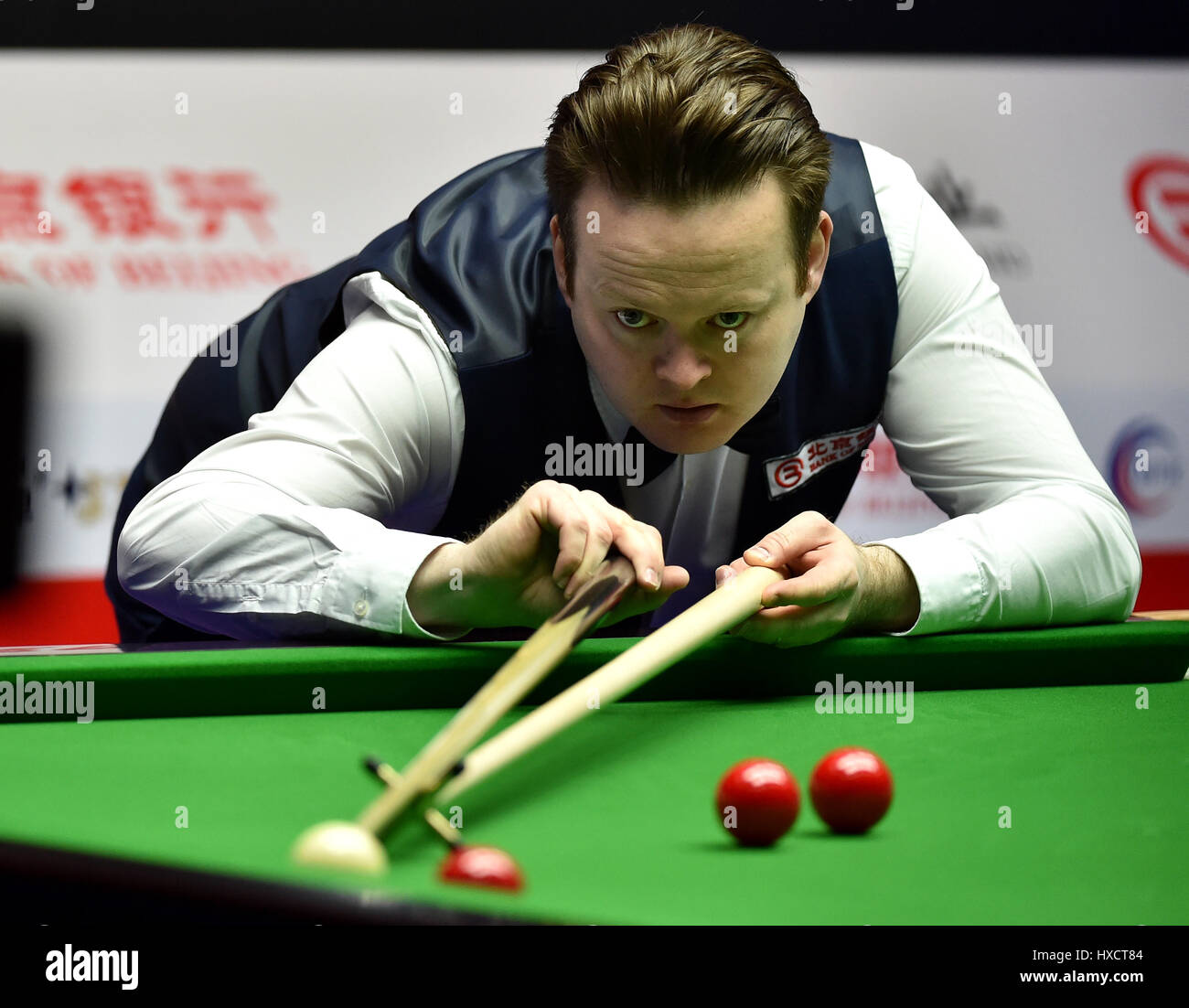 Beijing, China. 27th Mar, 2017. Shaun Murphy of England competes during ...