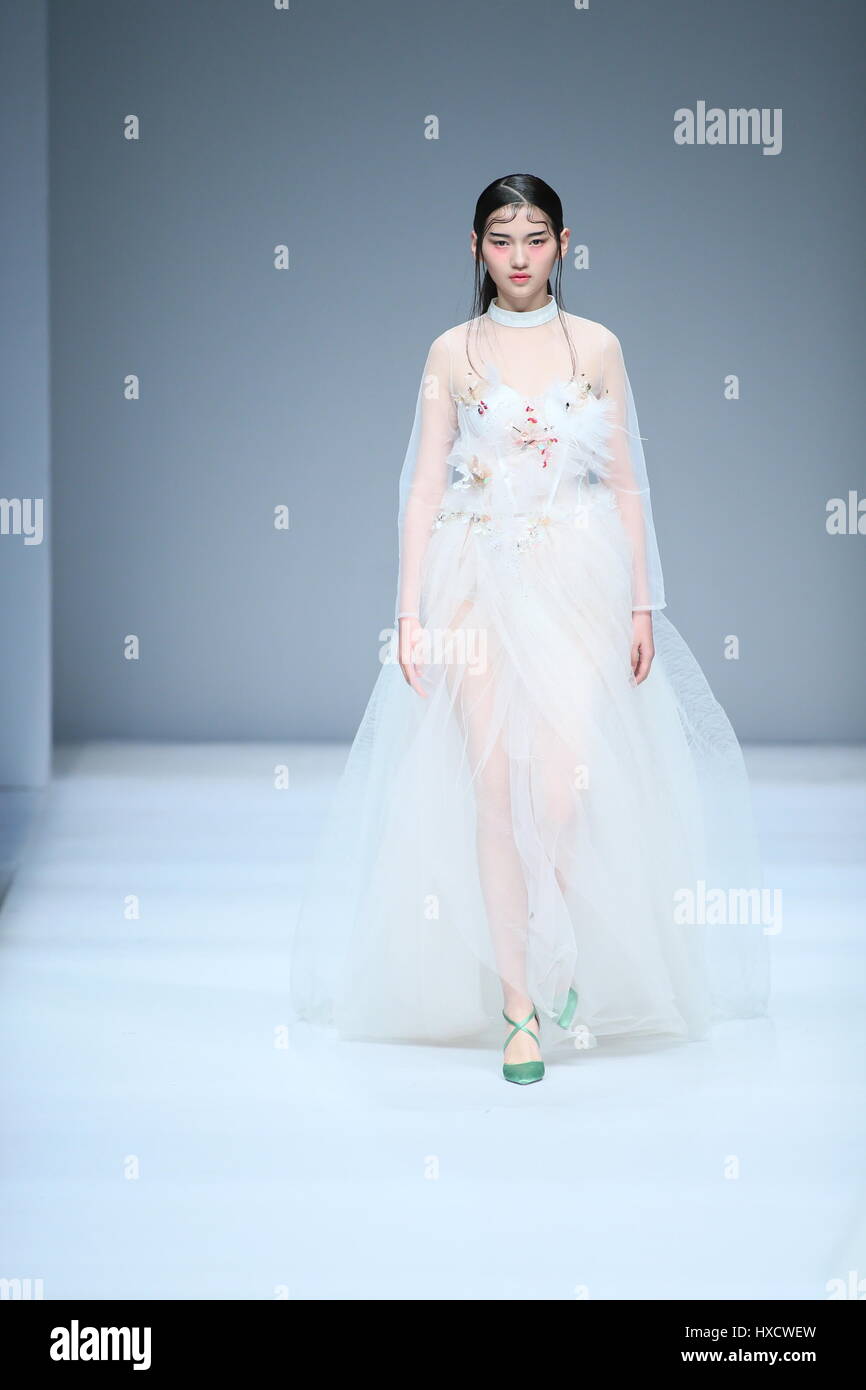 Beijing, Beijing, China. 27th Mar, 2017. A model presents a creation of ...