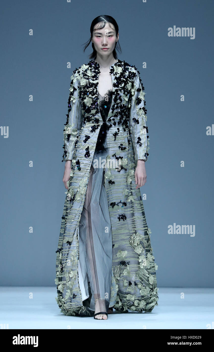 Beijing, China. 27th Mar, 2017. A model presents a creation designed by ...