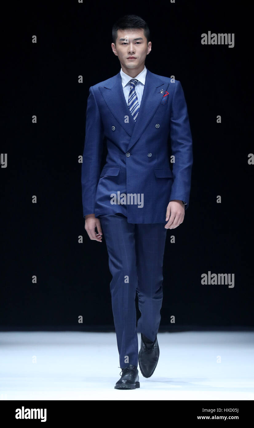 Beijing, China. 27th Mar, 2017. A model presents a creation designed by ...