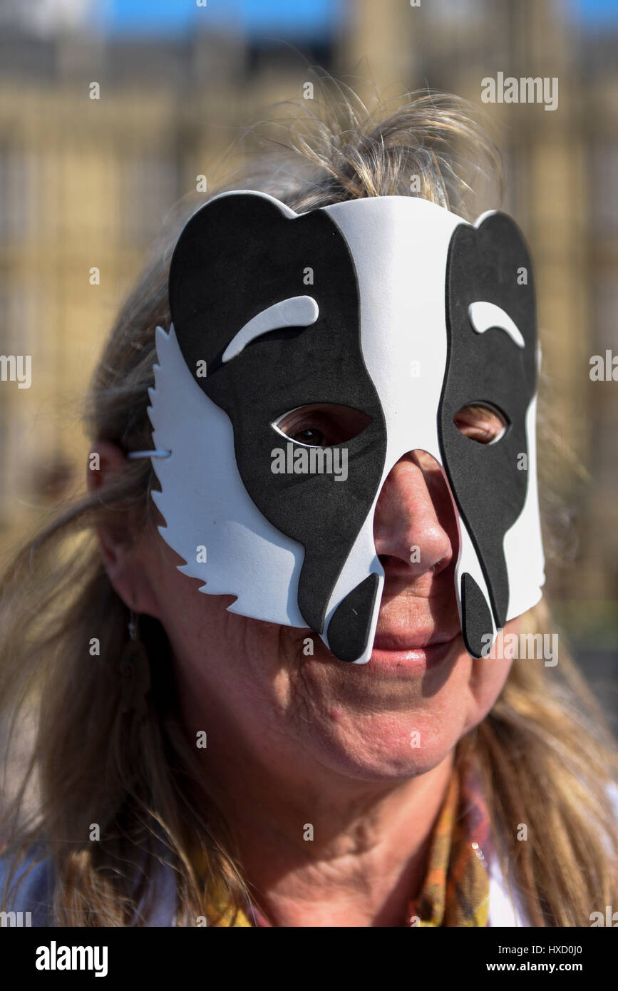 London, UK. 27th Mar, 2017. A woman wearing a badger mask joins animal ...