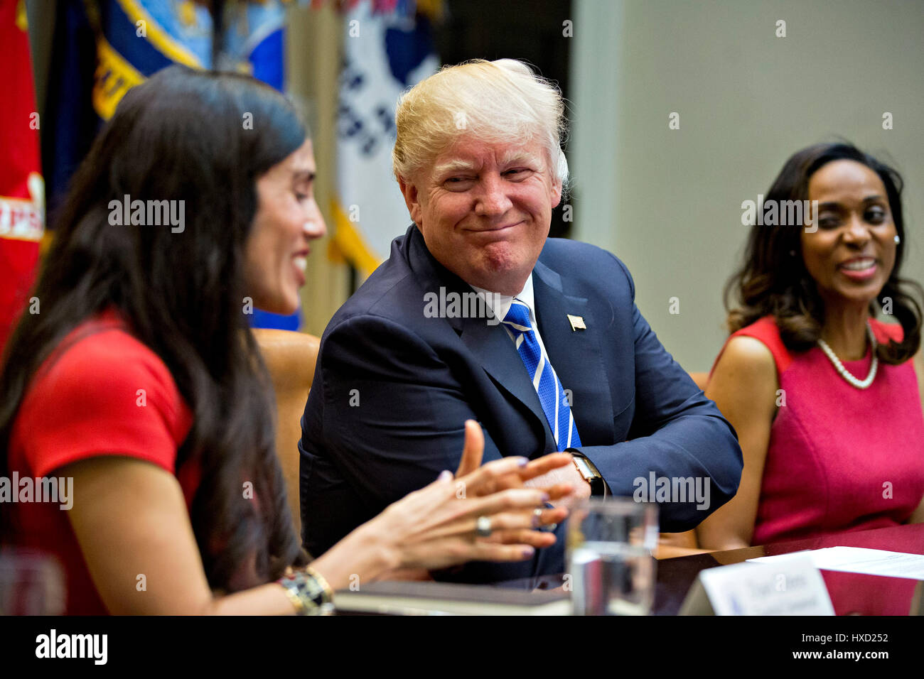 U.S. President Donald Trump listens as Dyan Gibbens, founder and chief ...