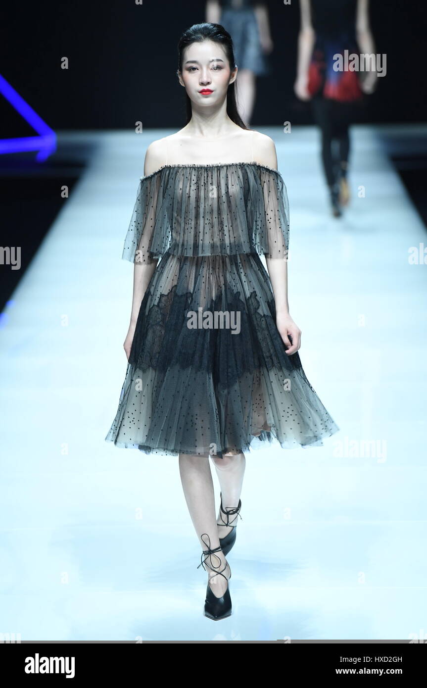 Beijing, China. 27th Mar, 2017. A model presents a creation of Chinese ...