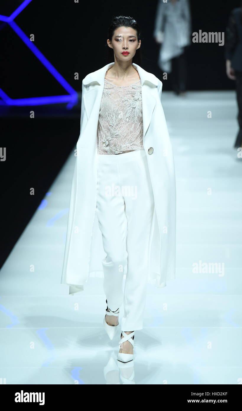 Beijing, China. 27th Mar, 2017. A model presents a creation of Chinese ...