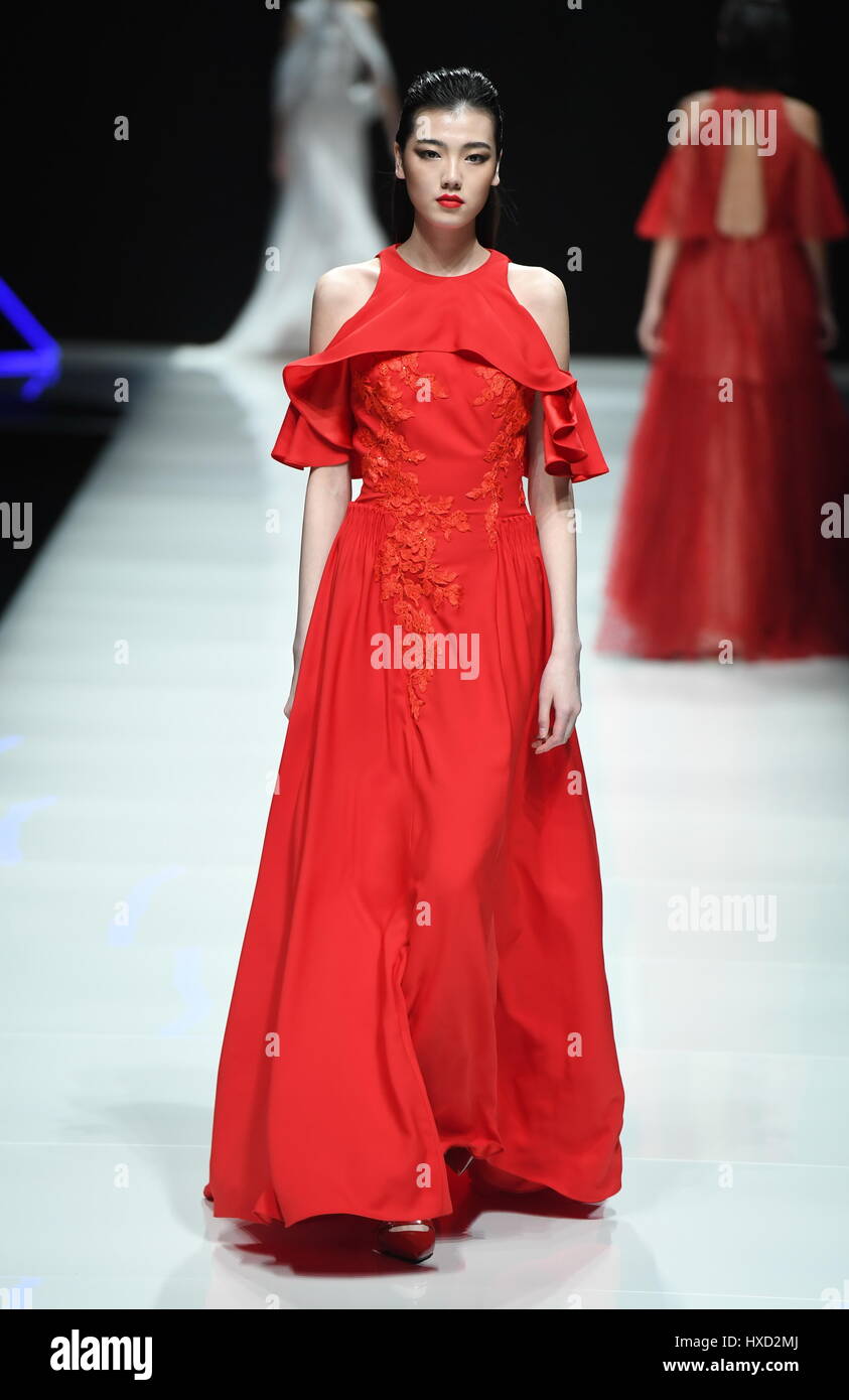 Beijing, China. 27th Mar, 2017. A model presents a creation of Chinese ...