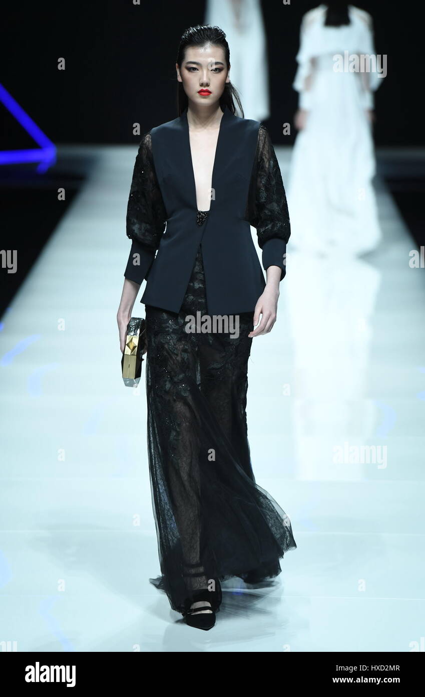 Beijing, China. 27th Mar, 2017. A model presents a creation of Chinese ...