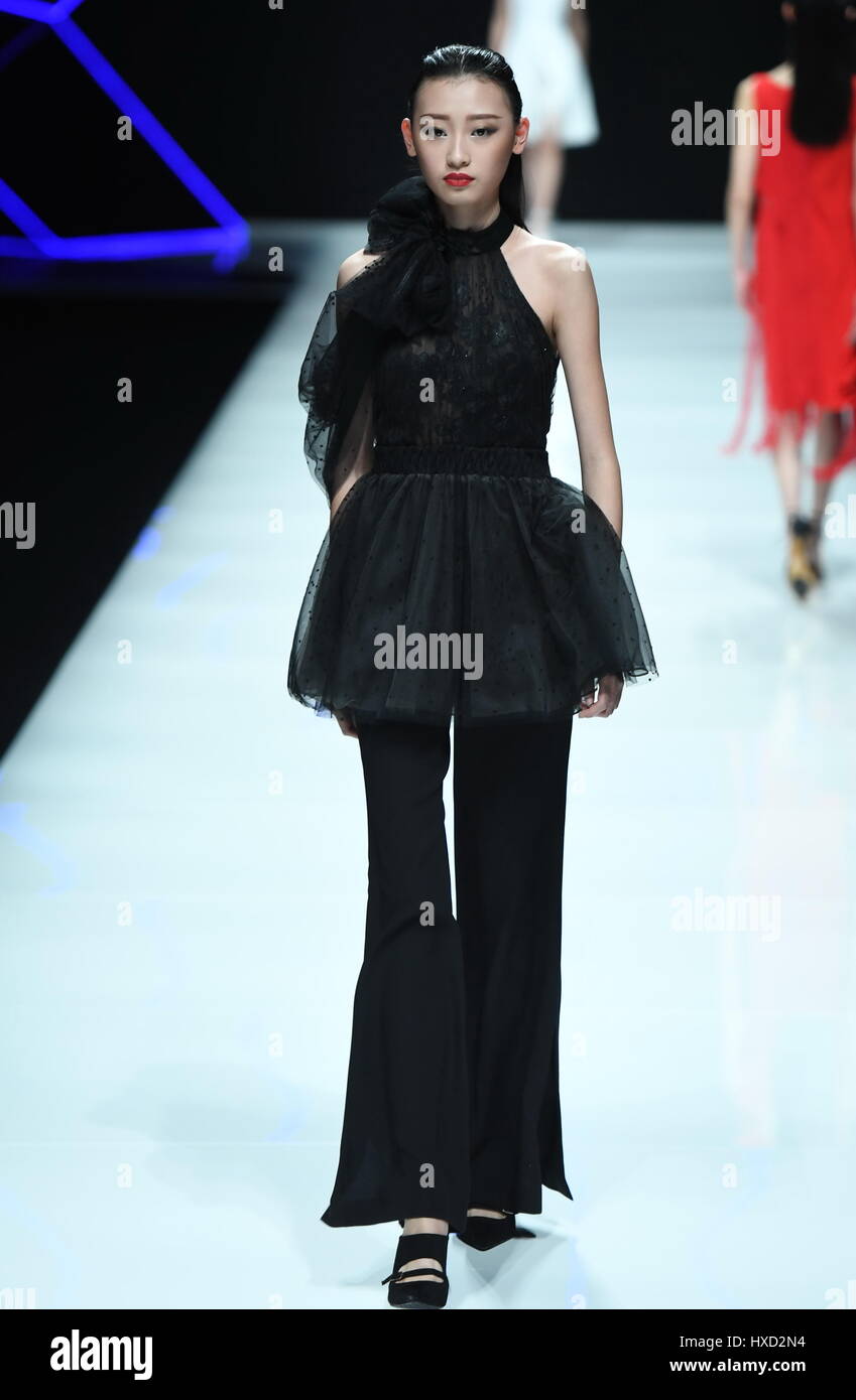 Beijing, China. 27th Mar, 2017. A model presents a creation of Chinese ...