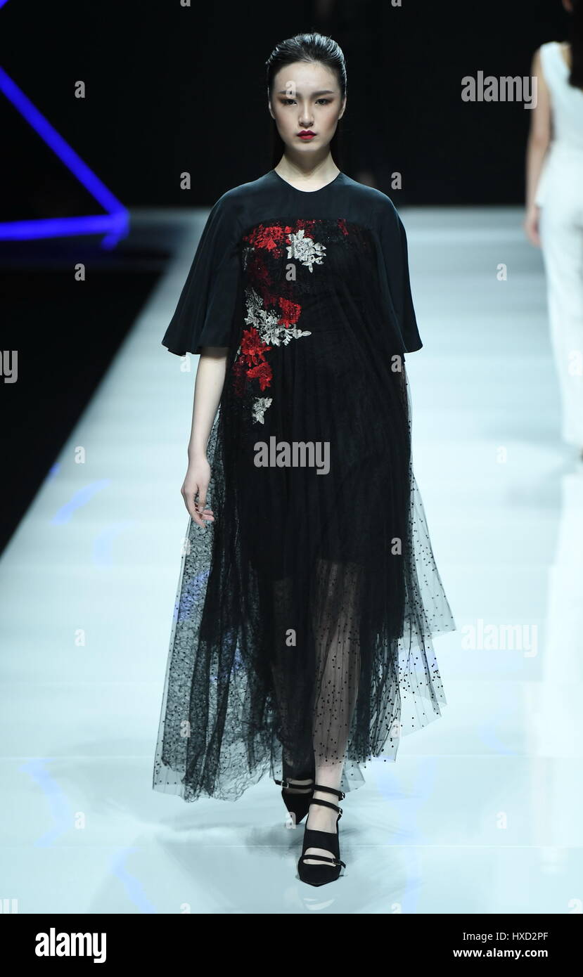 Beijing, China. 27th Mar, 2017. A model presents a creation of Chinese ...