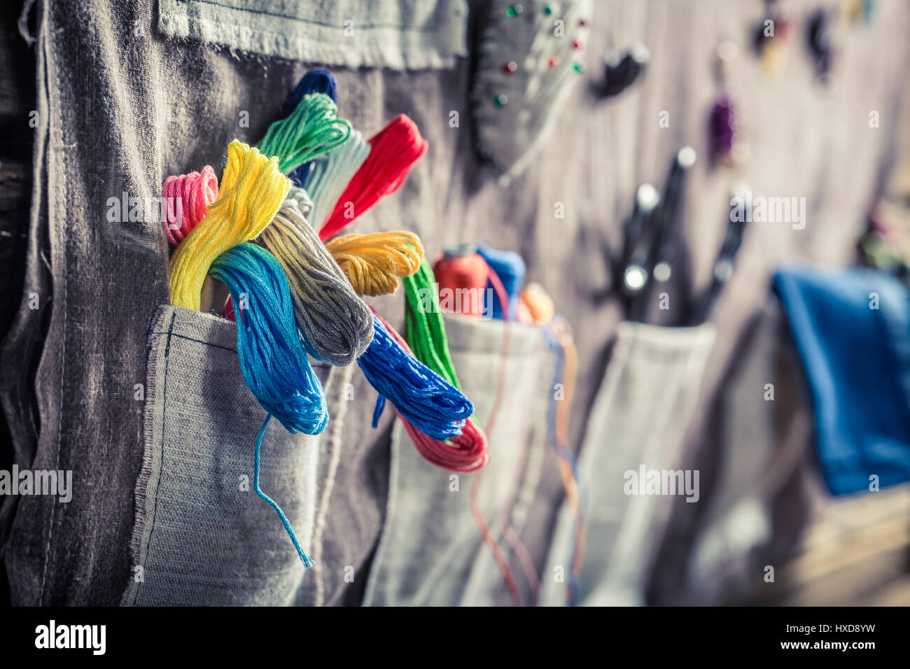 Handmade background made of needles, threads and buttons in tailor ...