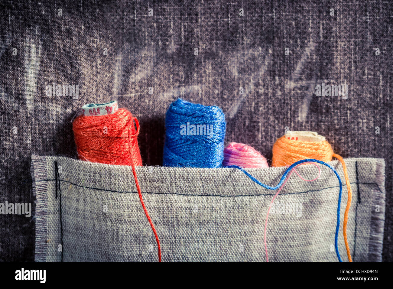 Colored threads in the pocket of the mat tailor Stock Photo - Alamy
