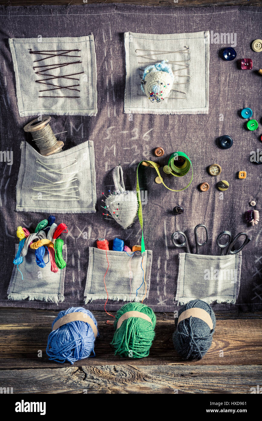 Vintage background made of needles, threads and buttons in tailor ...