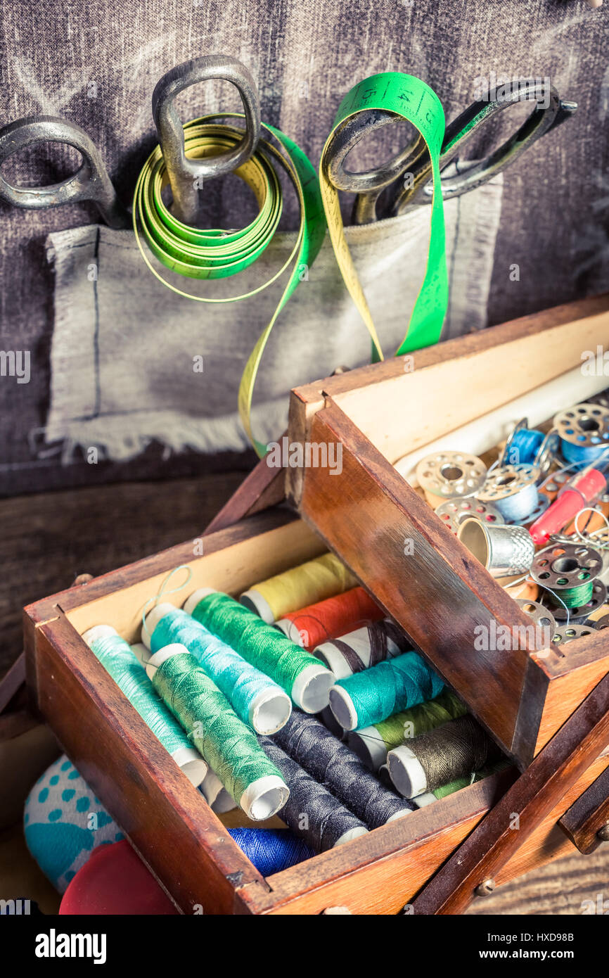 Vintage tailor's wooden box with needles, threads and buttons Stock ...