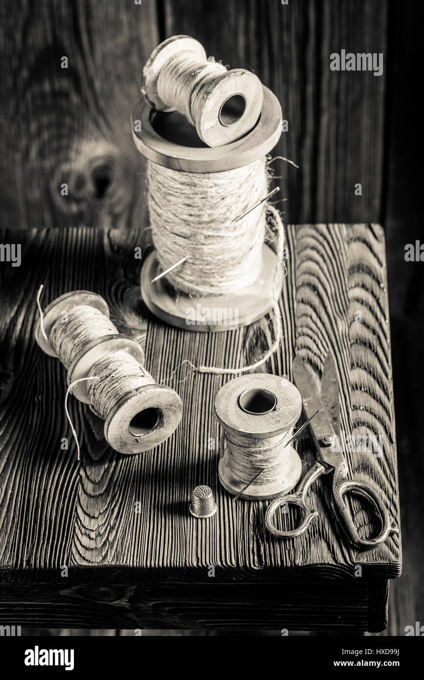 Sewing table with threads and scissors Stock Photo - Alamy