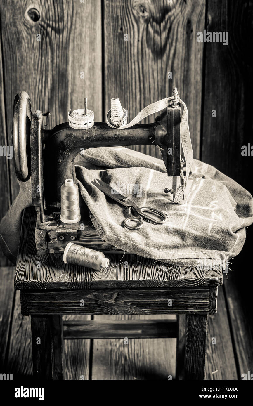 Tailor machine with scissors, cloth and threads Stock Photo - Alamy