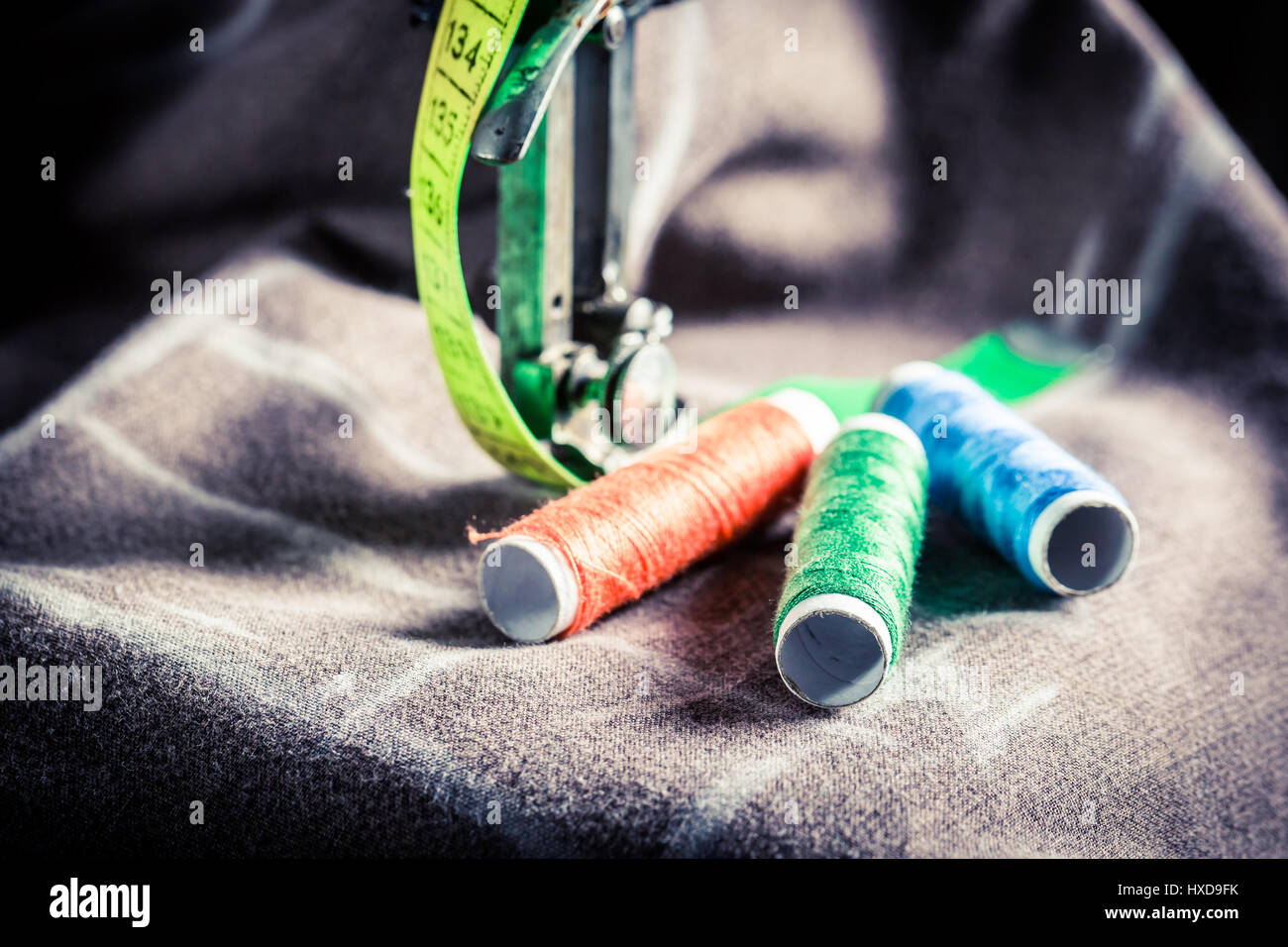 Old sewing machine with needle, threads and tailor tape Stock Photo - Alamy