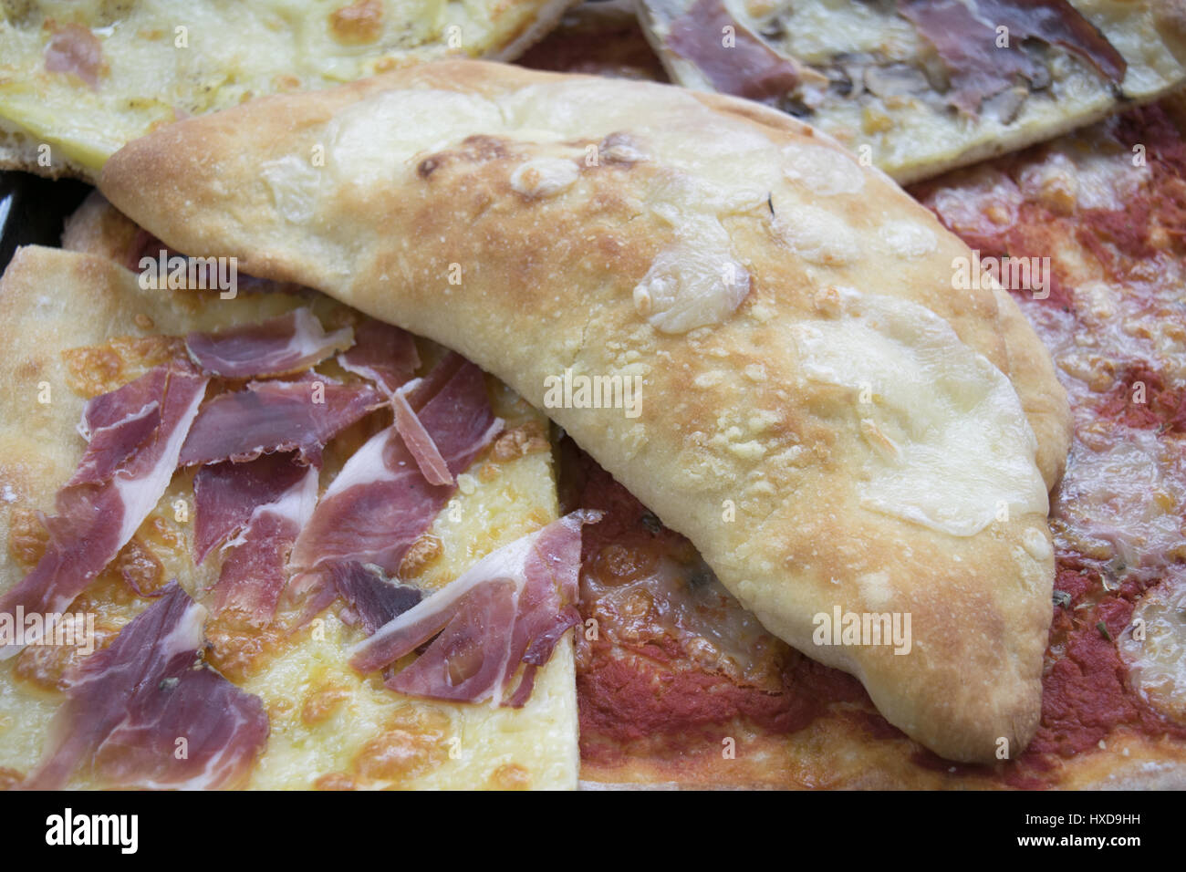 calzone the typical folded pizza stuffed with mozzarella and cured ham ...