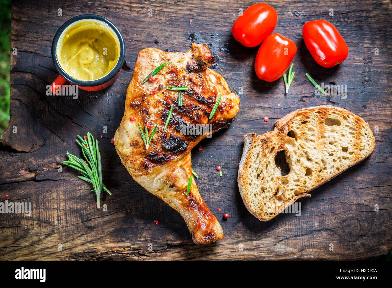 Roasted chicken leg with toast and cherry tomato Stock Photo - Alamy