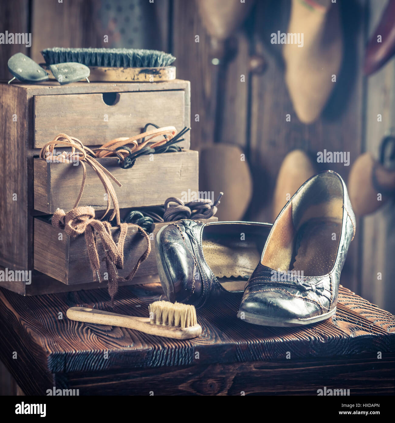 Old shoemaker workshop with shoes, laces and tools Stock Photo - Alamy