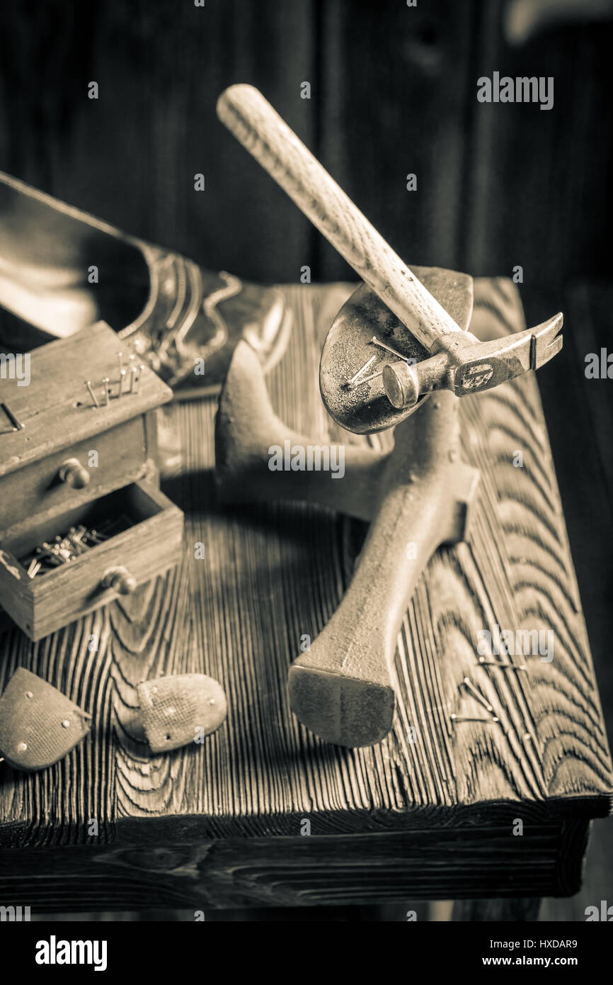 Old shoemaker workplace with shoes, laces and tools Stock Photo - Alamy
