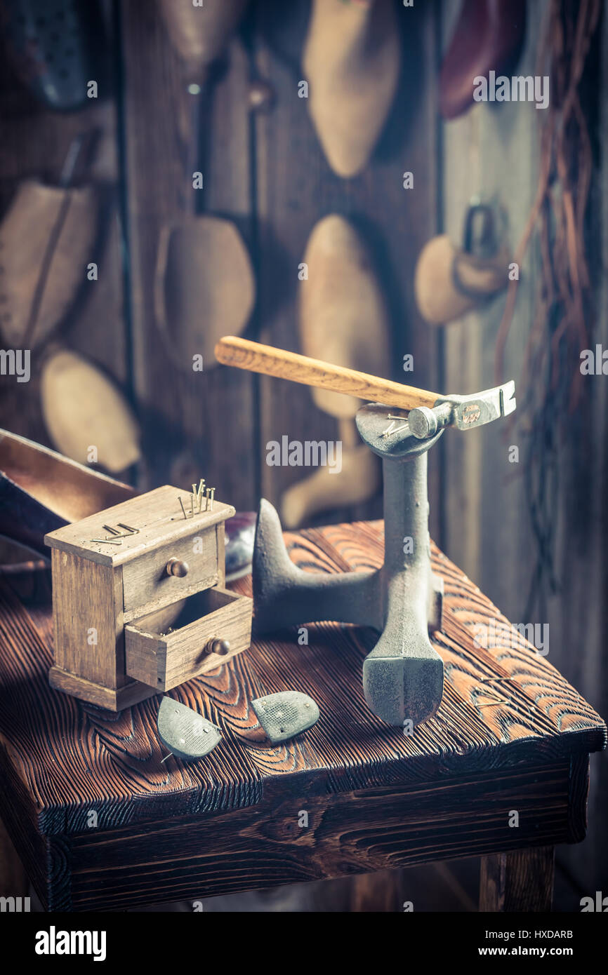 Old shoemaker workplace with tools, shoes and leather Stock Photo - Alamy