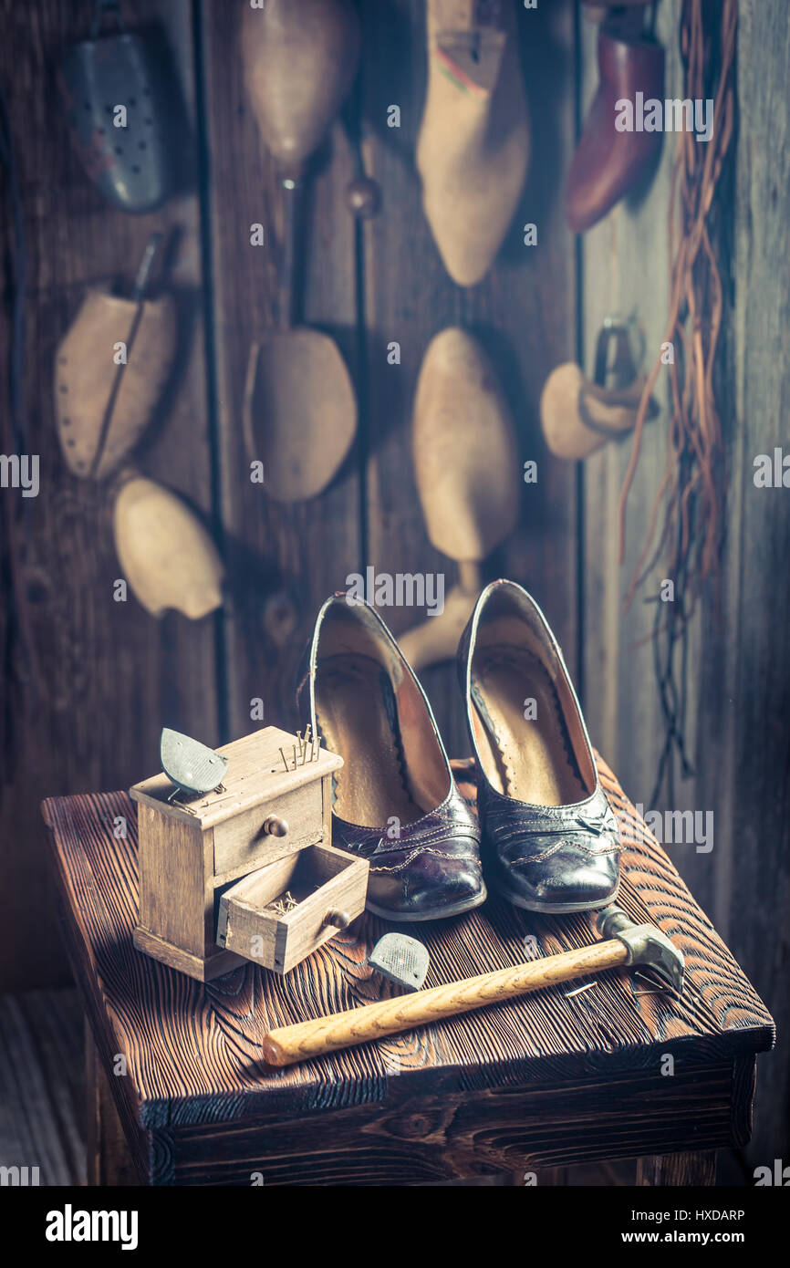 Old cobbler workshop with shoes, laces and tools Stock Photo - Alamy