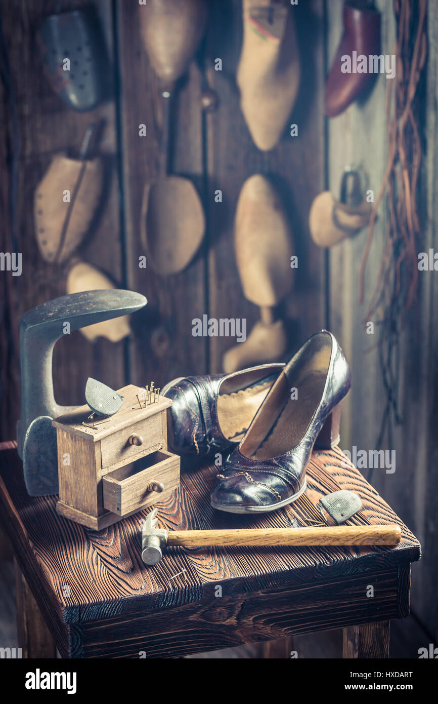Old cobbler workshop with tools, shoes and leather Stock Photo - Alamy