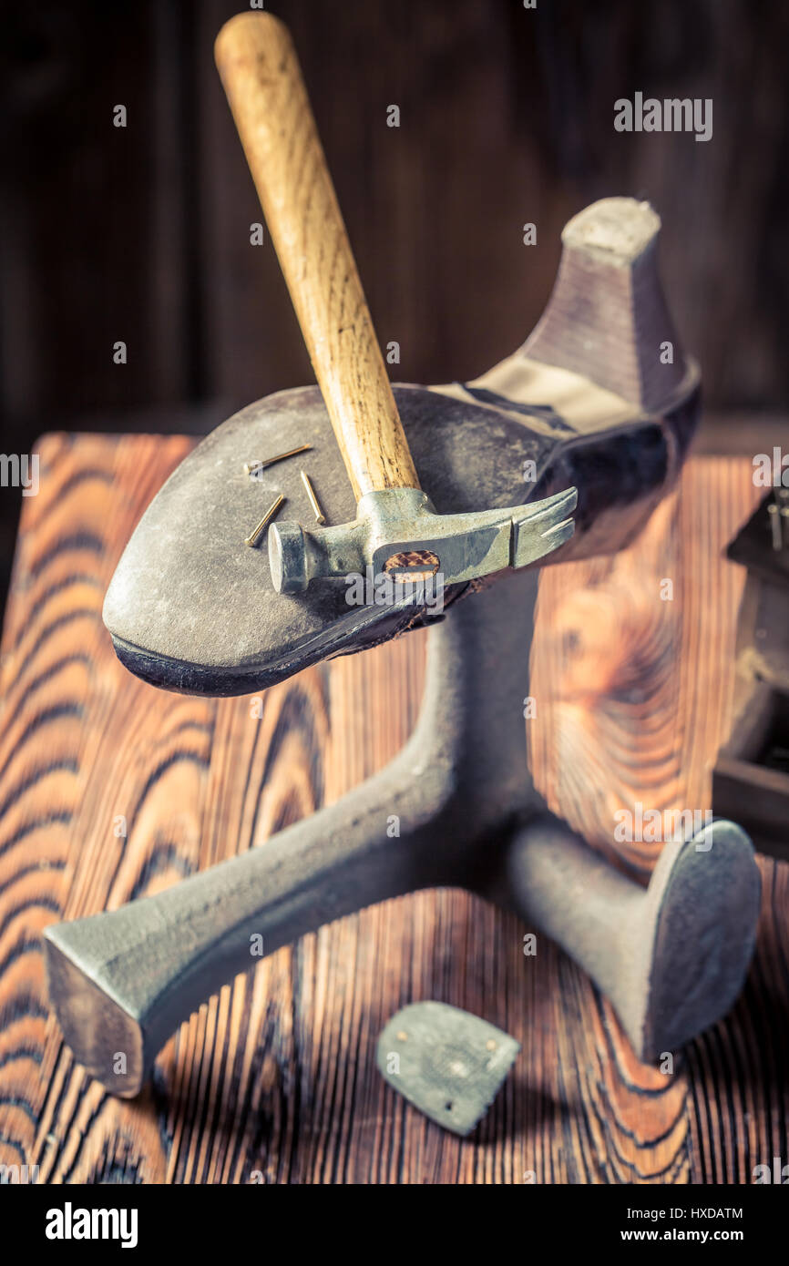 Old cobbler workplace with tools, leather and shoes Stock Photo - Alamy