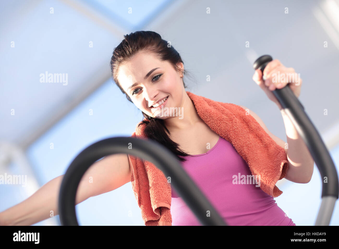 Young woman in modern gym doing exercises Stock Photo - Alamy