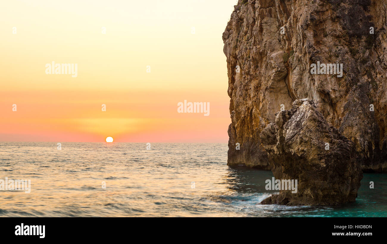 Cliff shore sunset Stock Photo - Alamy