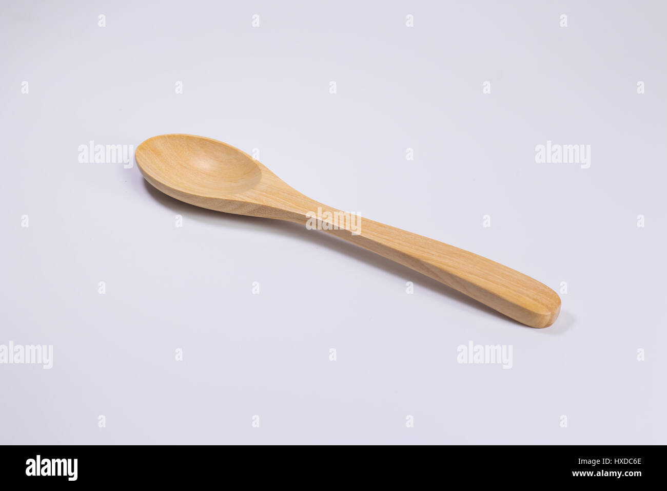 little spoon wooden on white background Stock Photo - Alamy