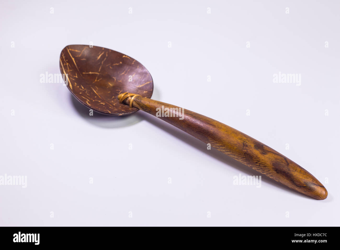 vintage brown thai spoon on white background Stock Photo - Alamy