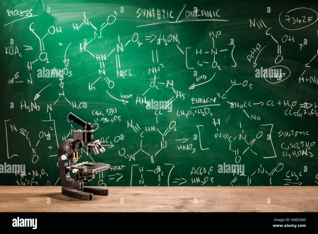 Microscope, blackboard with chemical formulas Stock Photo - Alamy