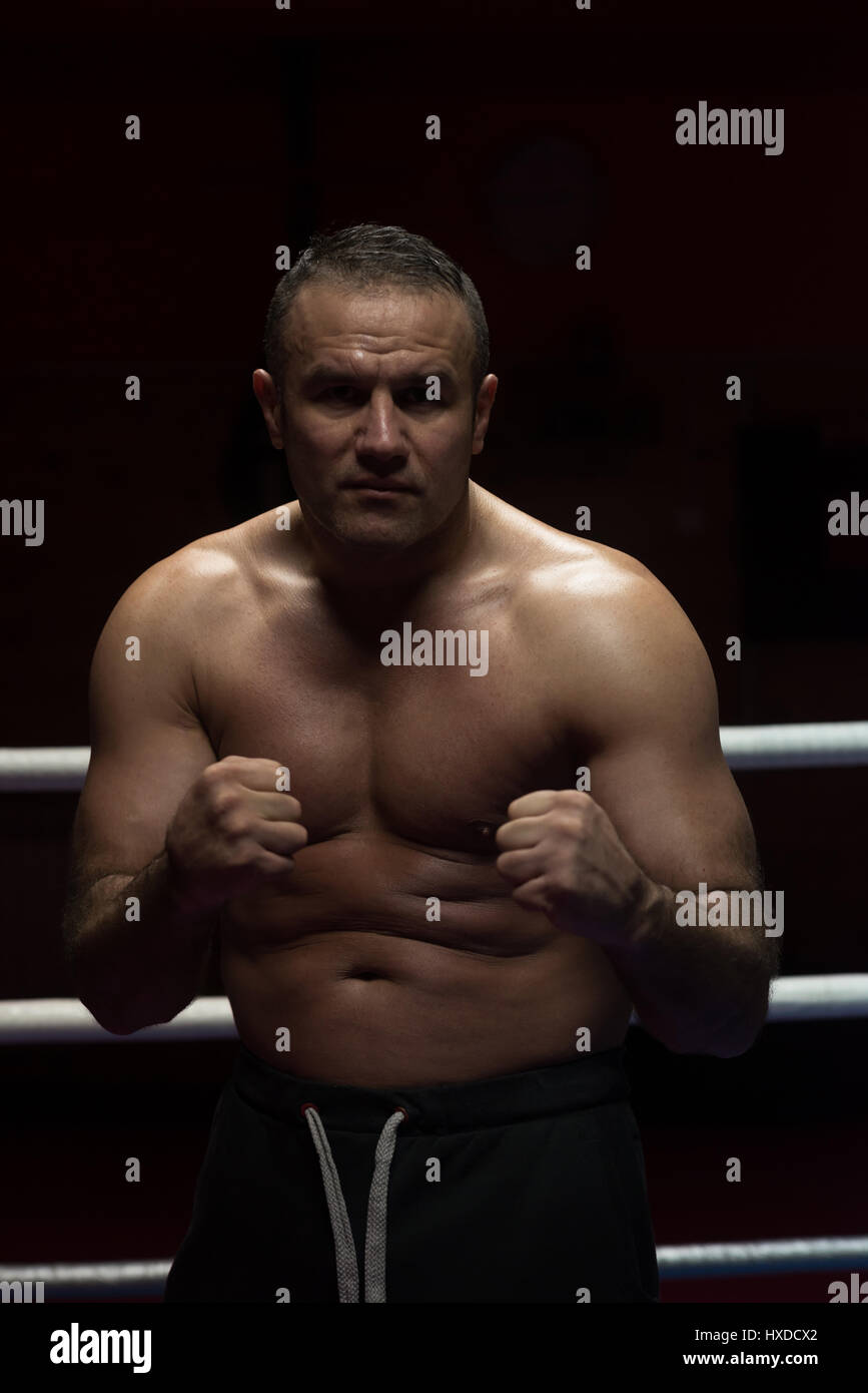 professional kickboxer with hands in martial arts position training for ...