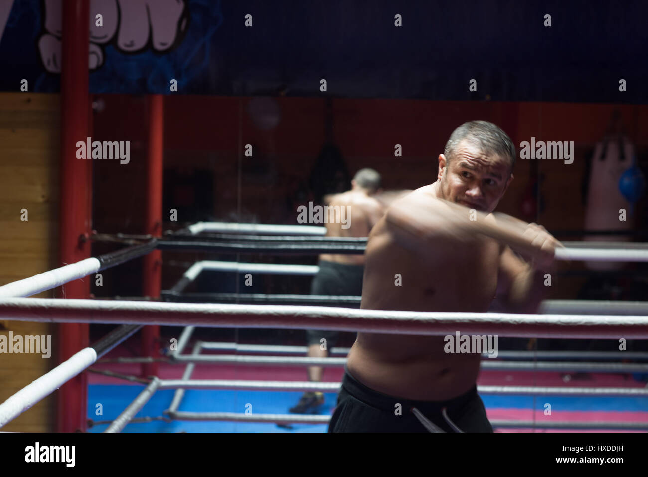 professional kickboxer with hands in martial arts position training for ...