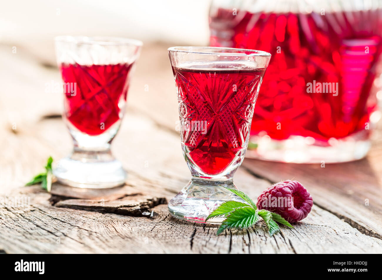 Fresh liqueur made of alcohol and raspberries Stock Photo - Alamy