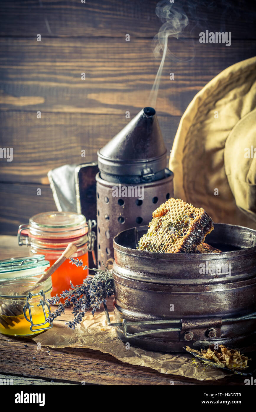 Age tools for beekeeping in countryside Stock Photo - Alamy