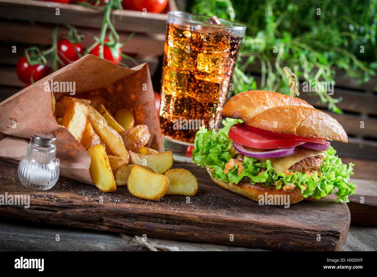 Homemade burger made with chicken, fries and cold drink Stock Photo - Alamy