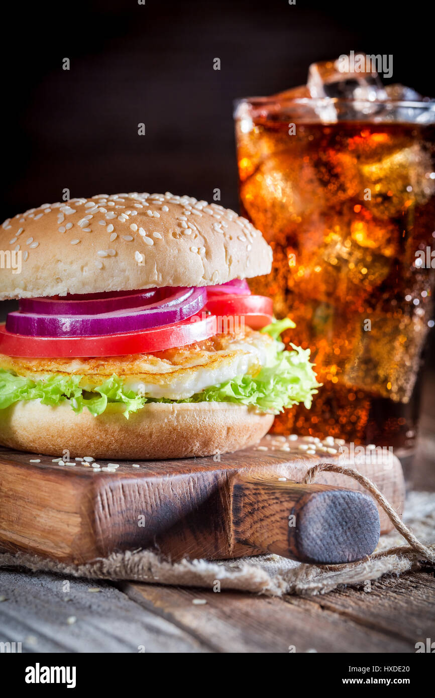Closeup of tasty burger with cold drink Stock Photo - Alamy
