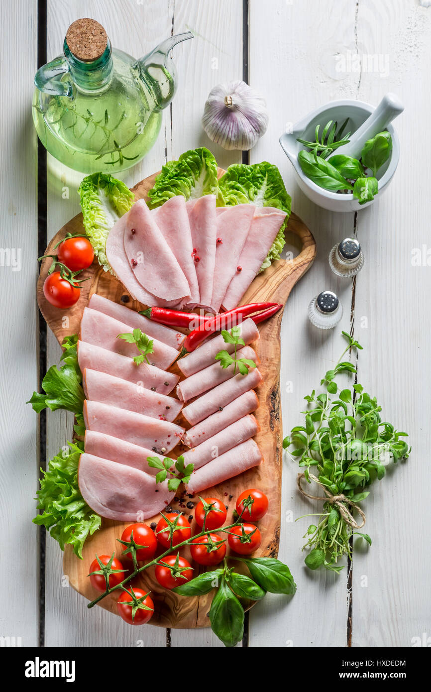 Closeup of smoked cold cuts with pepper and herbs Stock Photo - Alamy