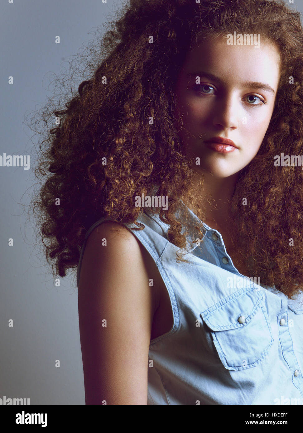 Close up cross processed portrait of a beautiful young fashion model in ...
