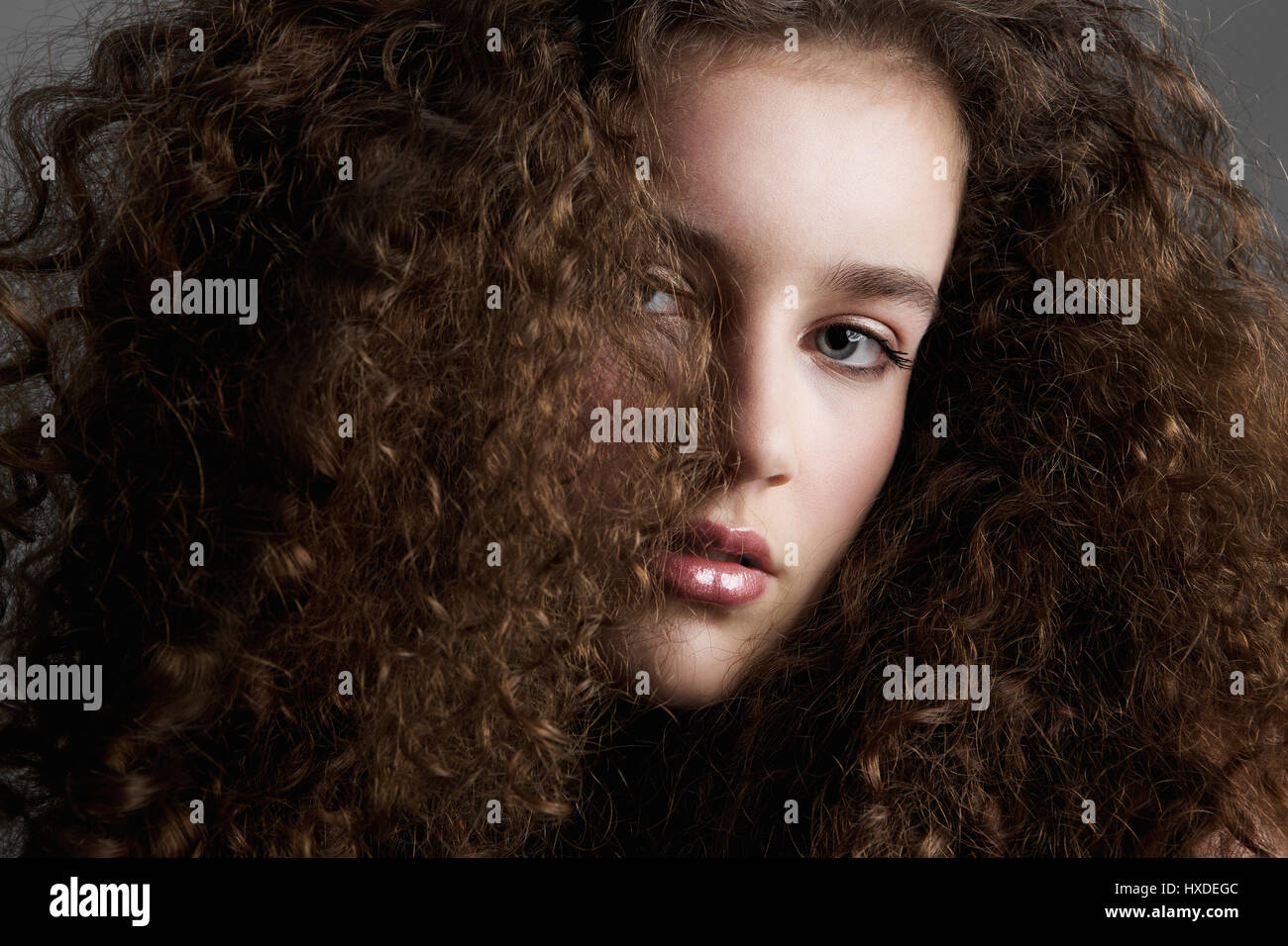 Close up portrait of a curly hair beauty fashion model Stock Photo - Alamy