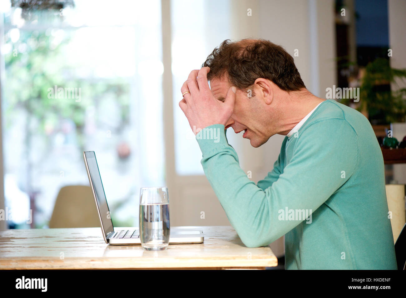 Man looking stressed at his desk hi-res stock photography and images ...