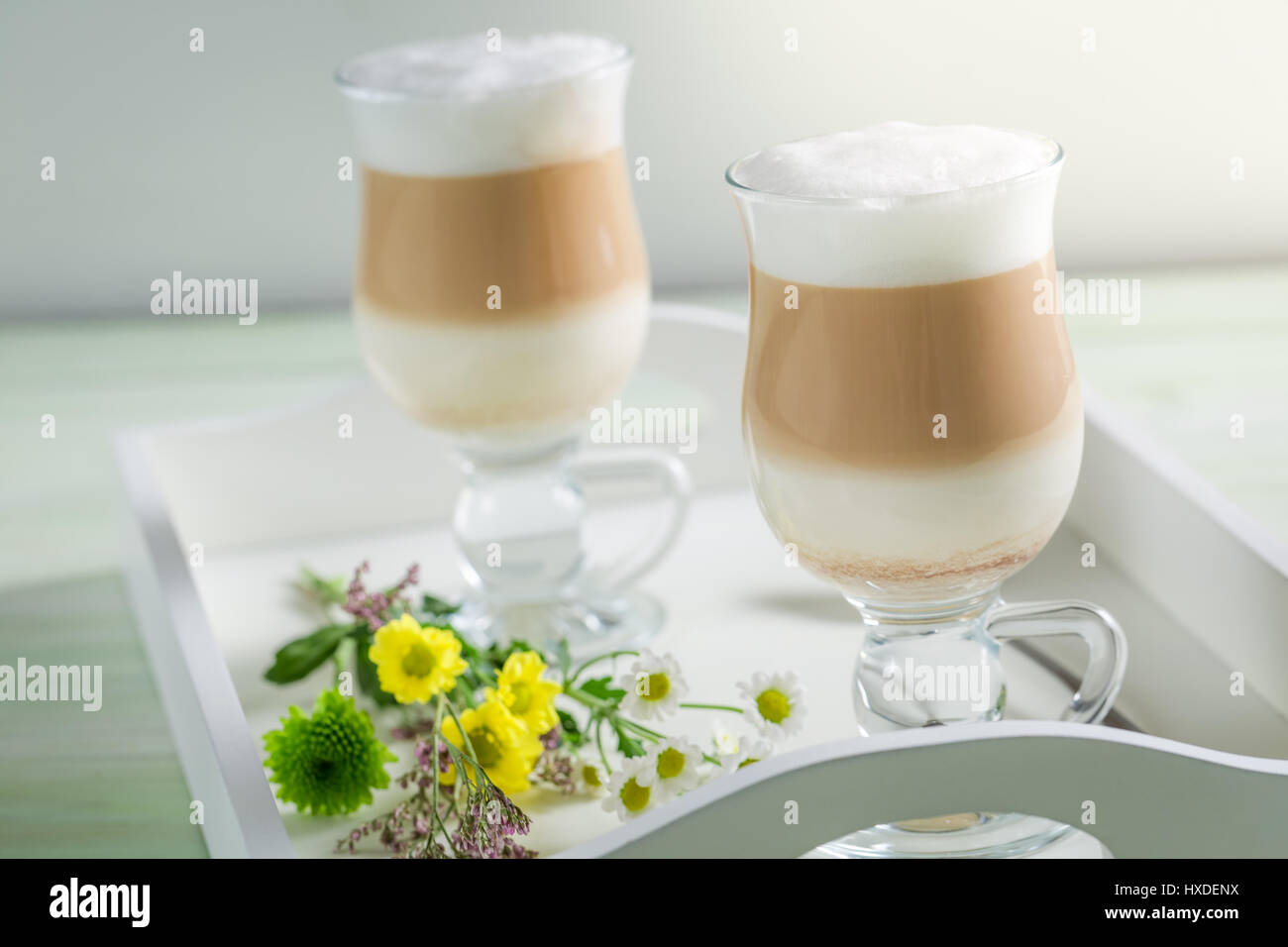 Two latte coffee in spring Stock Photo - Alamy