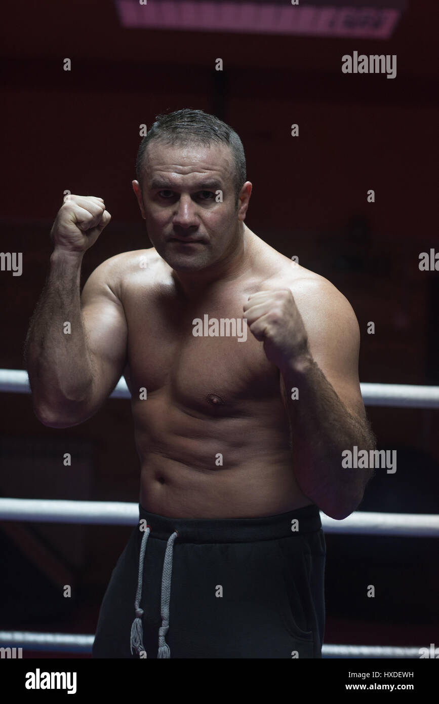 professional kickboxer with hands in martial arts position training for ...