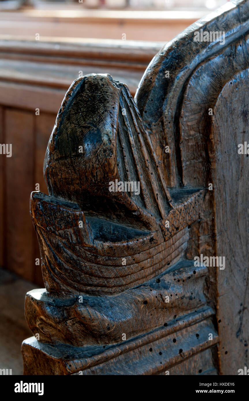 A medieval carved bench end in All Saints Church, Thornham, Norfolk ...