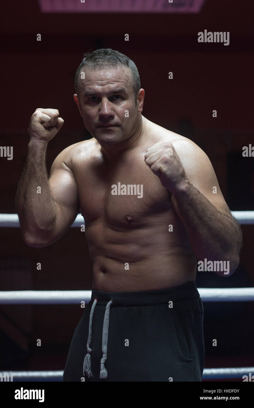 professional kickboxer with hands in martial arts position training for ...