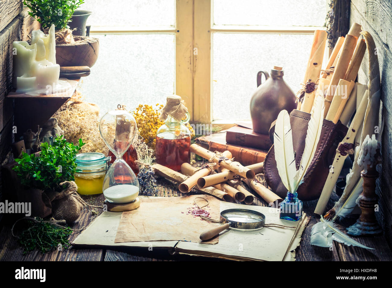 Magical witch workshop with scrolls and ingredients Stock Photo - Alamy