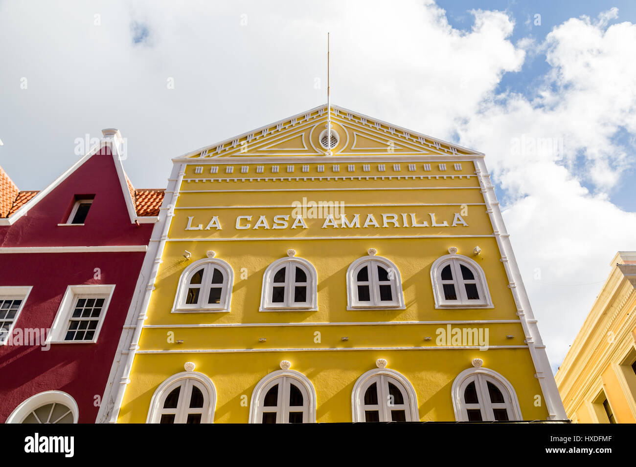 Colorful bright yellow building in Curacao Stock Photo - Alamy
